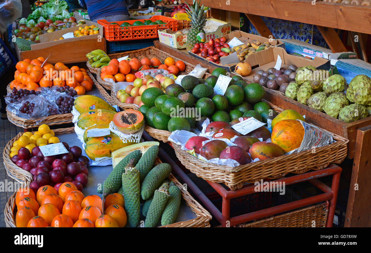 Fruits on market stall in indoor market at Funchal, Madeira, Portugal ...