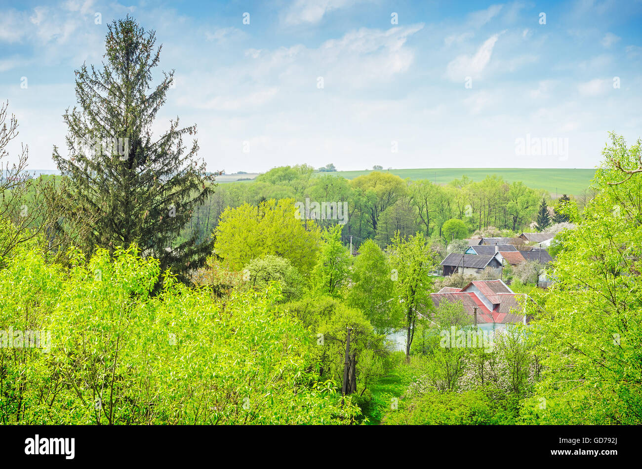 Ukrainian village in spring. Rural areas with small houses on the ...