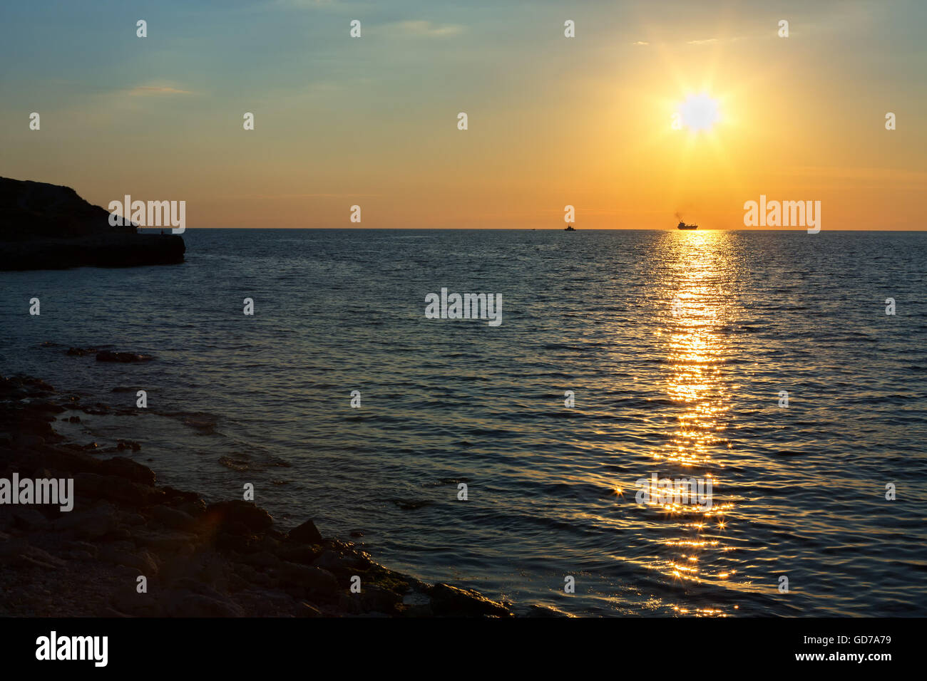Beautiful reflection of rays setting sun in the Black Sea. Sevastopol ...