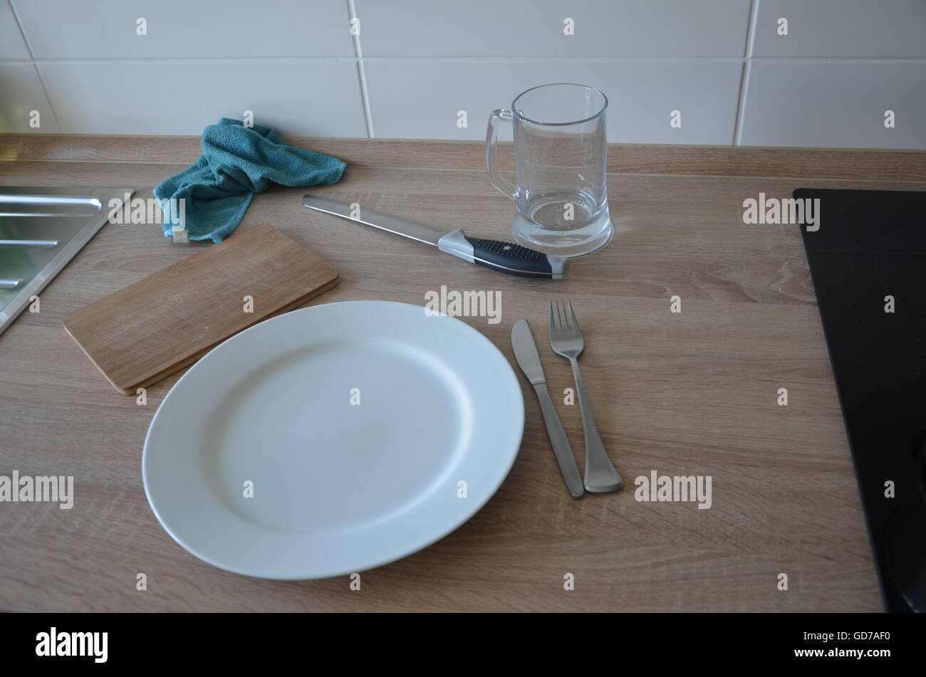 Single kitchen empty dishes Stock Photo - Alamy