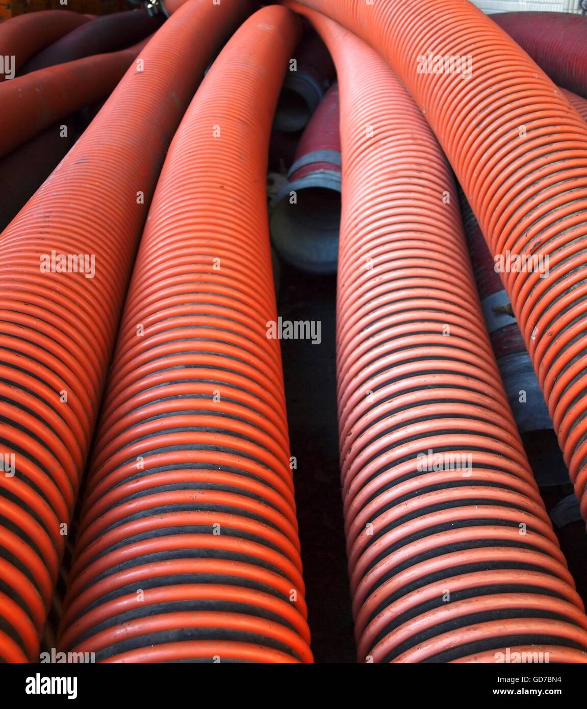 A pile of wide diameter sewage pipes made from corrugated plastic Stock ...