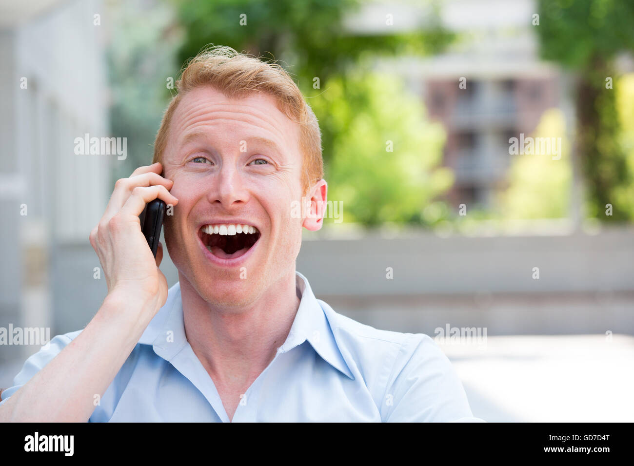 Closeup portrait, young happy ecstatic man with wide open mouth talking ...