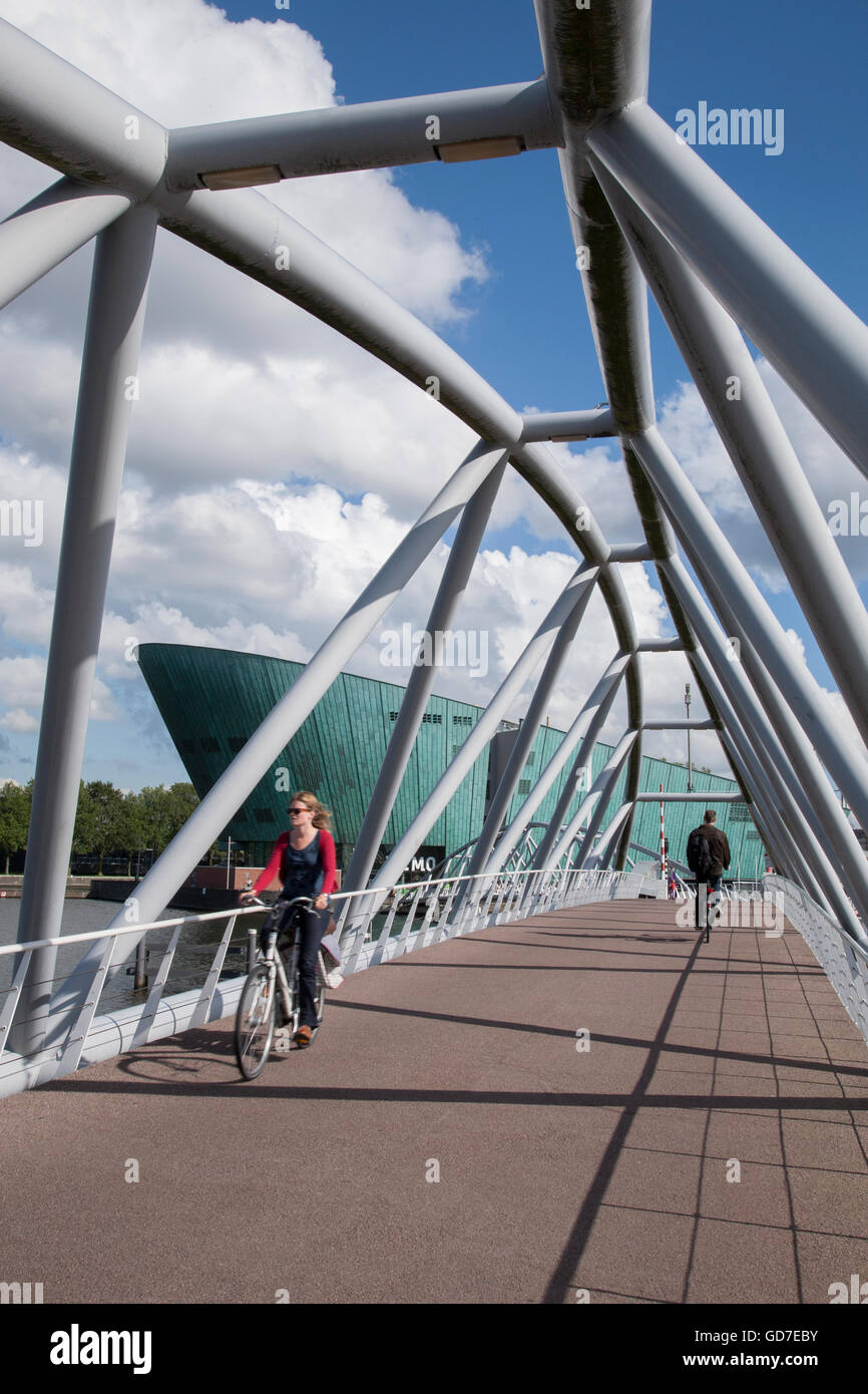 Canal Bridge to Nemo Science Museum with Cyclists, Amsterdam; Holland ...