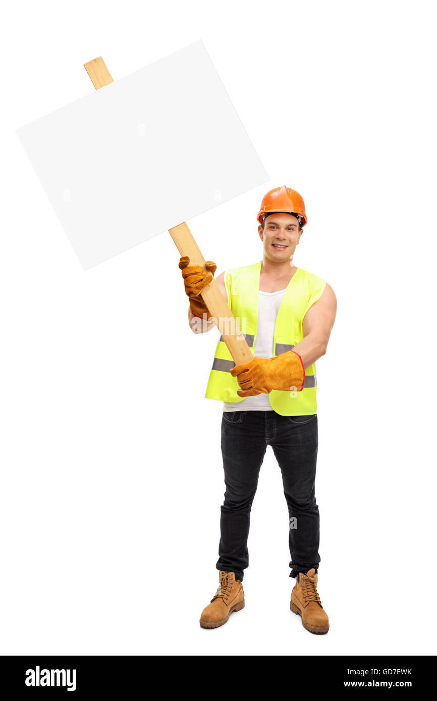 Full length portrait of a young construction worker holding a blank ...