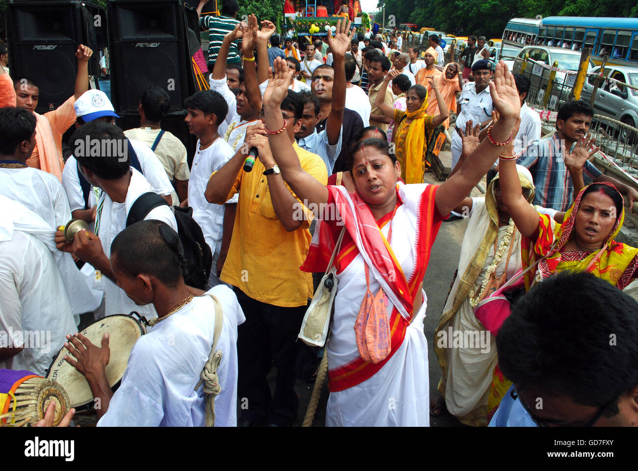 Lady Devotees are singing devotional songs of Lord Krishna in the city ...