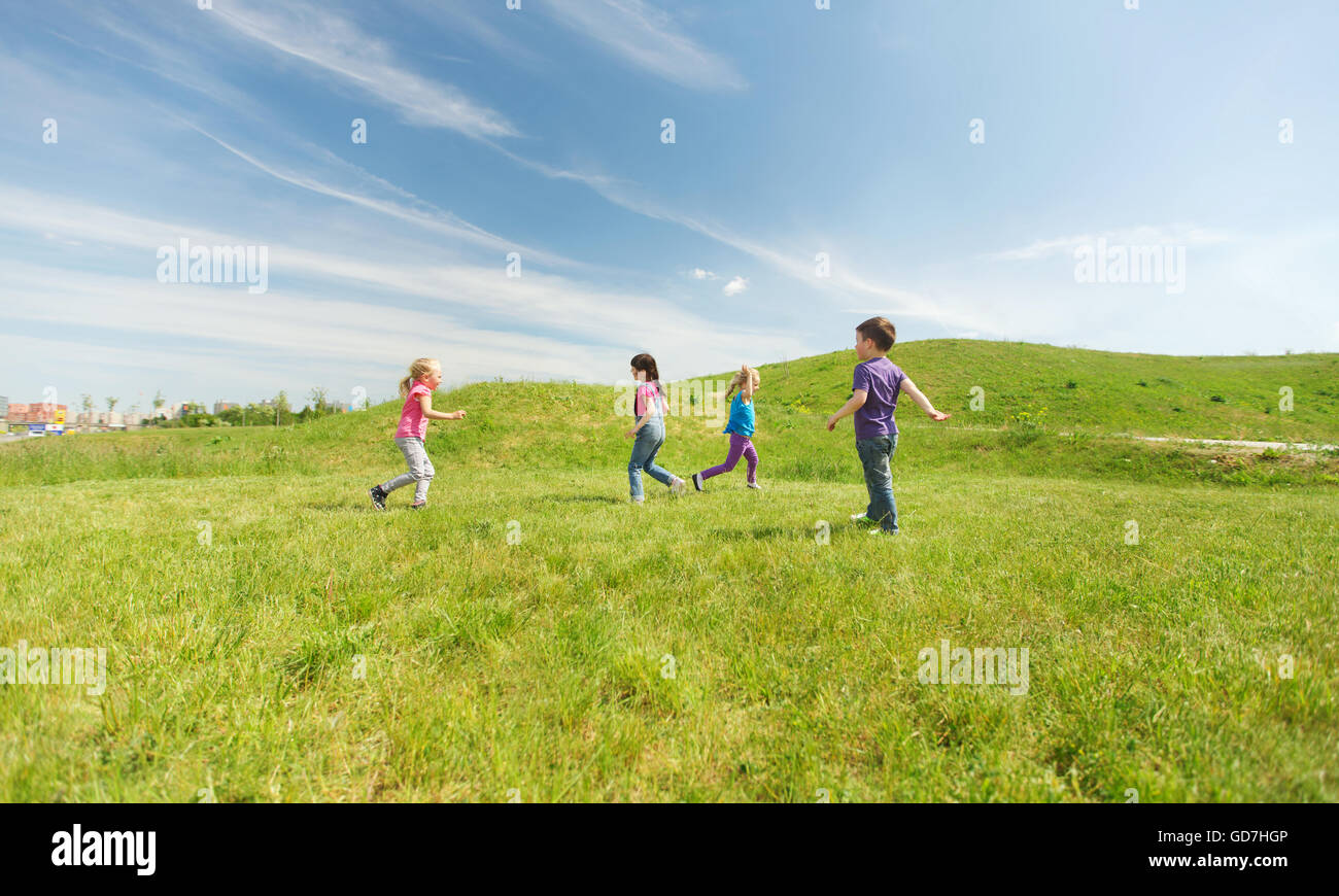 group of happy kids running outdoors Stock Photo - Alamy
