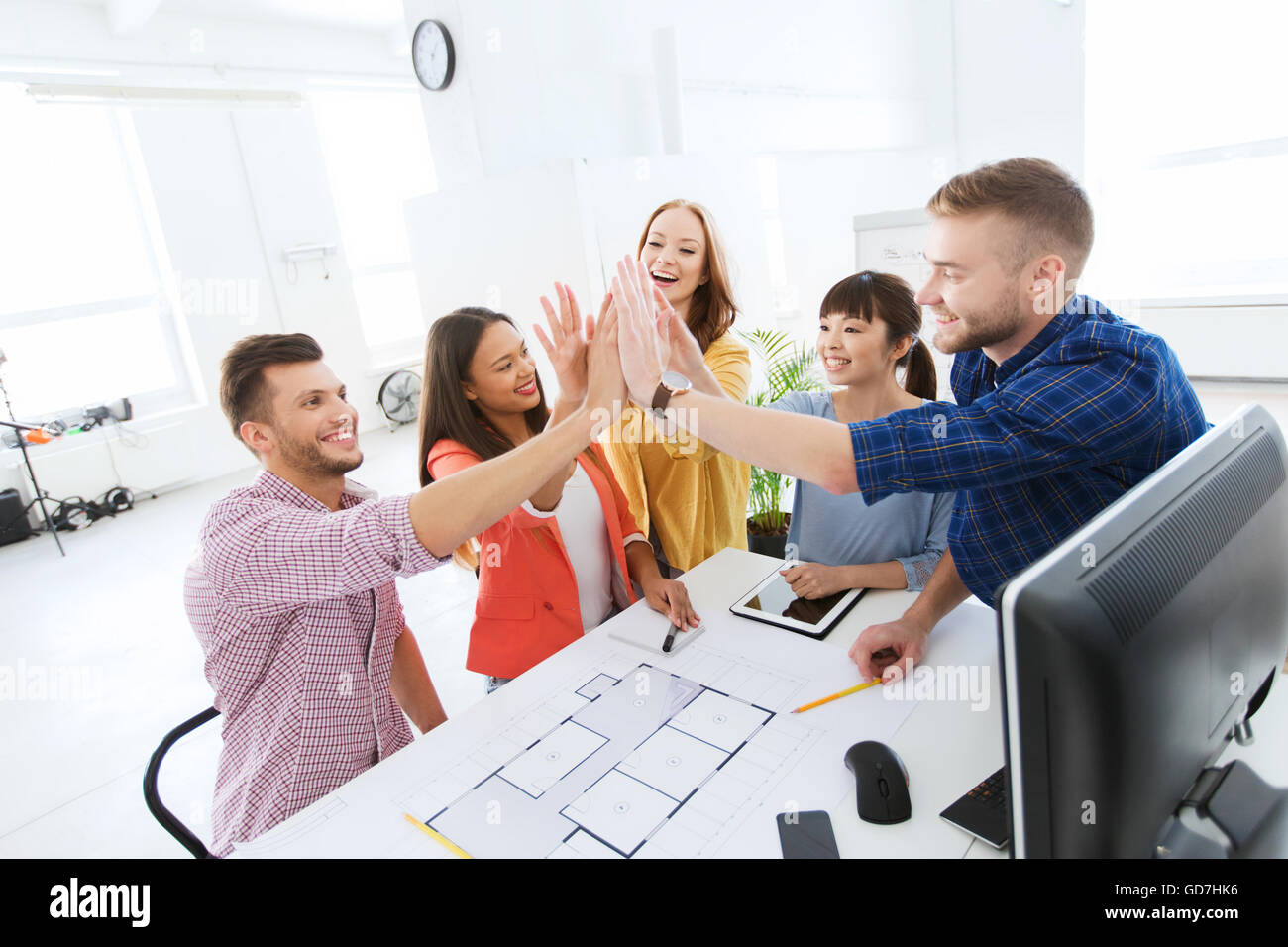 creative team making high five at office Stock Photo - Alamy