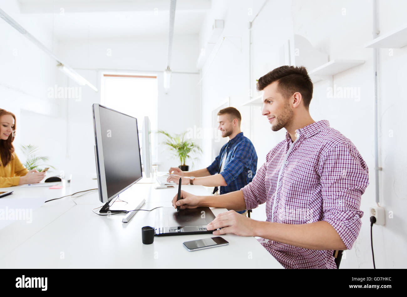 man or designer with computer and tablet at office Stock Photo - Alamy