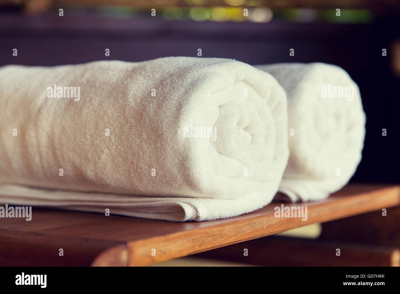rolled bath towels at hotel spa Stock Photo - Alamy