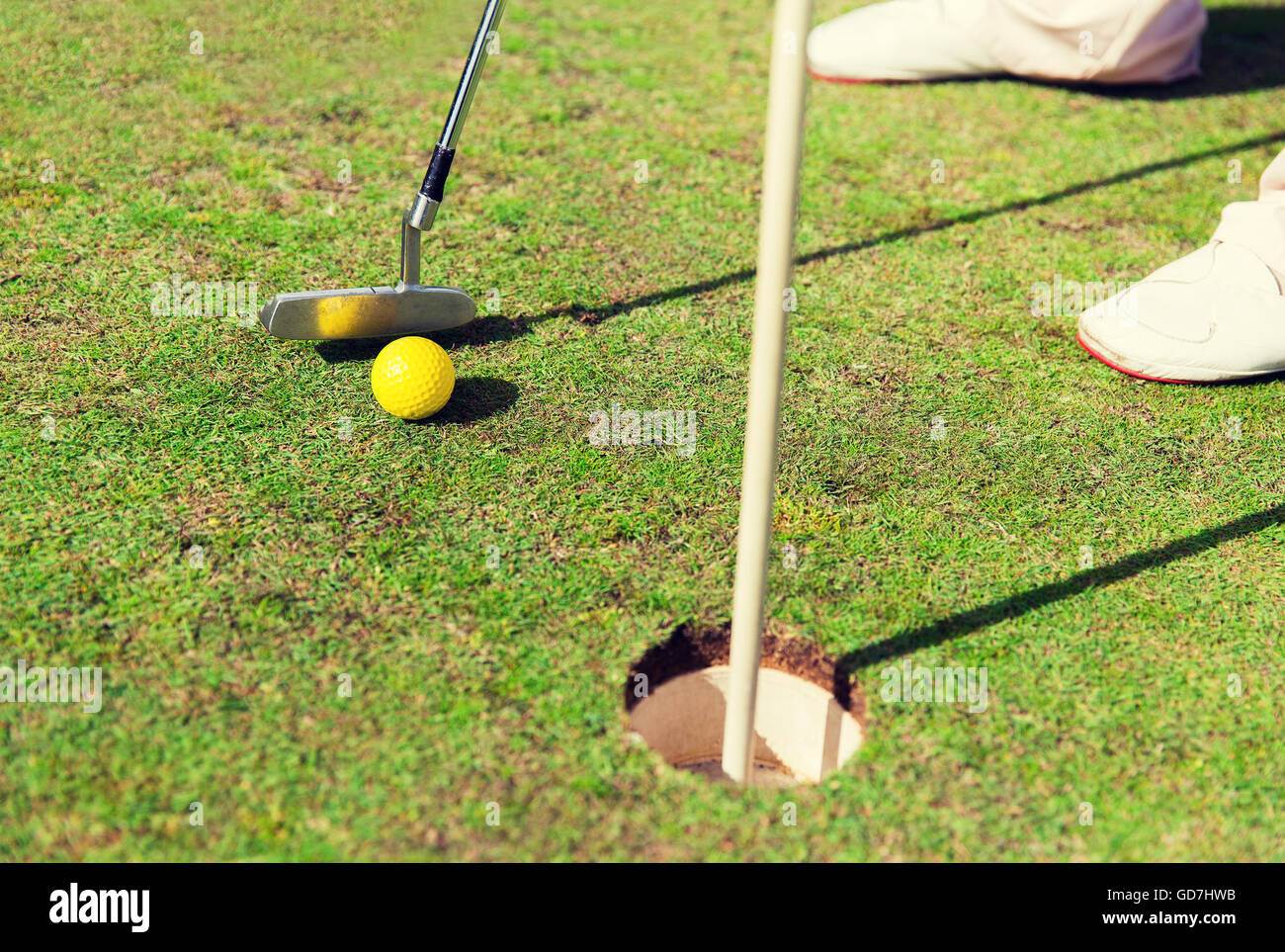 close up of man with club and ball playing golf Stock Photo - Alamy