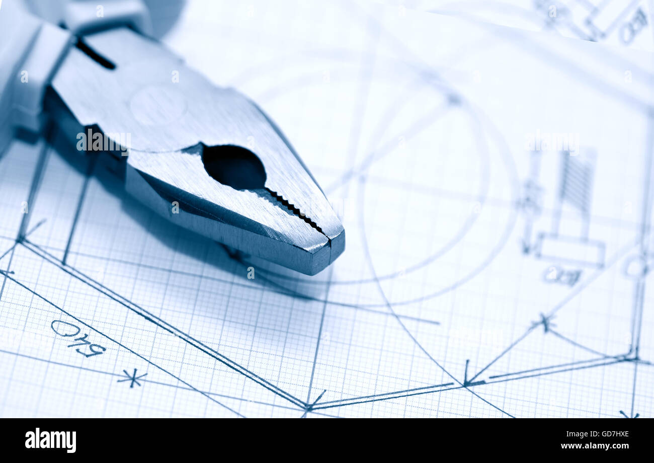Closeup of combination pliers on graph paper with chart Stock Photo - Alamy