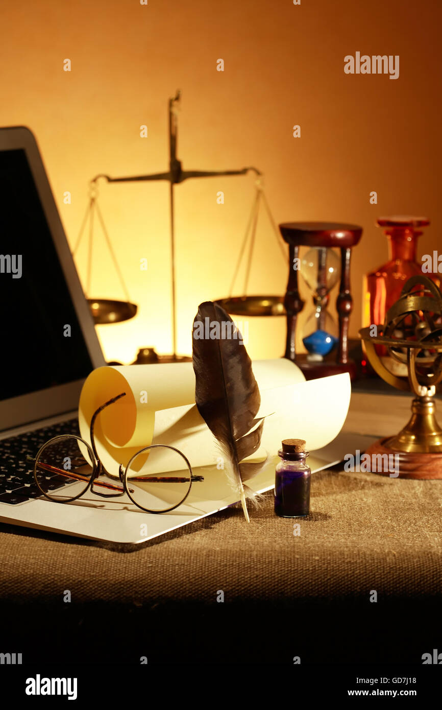 Science concept. Still life with few old things near modern laptop ...
