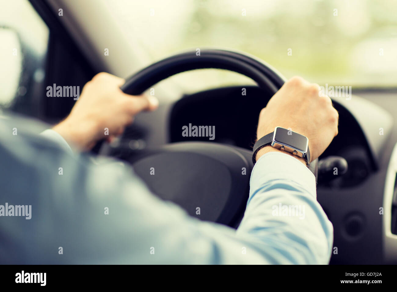 close up of man with wristwatch driving car Stock Photo - Alamy