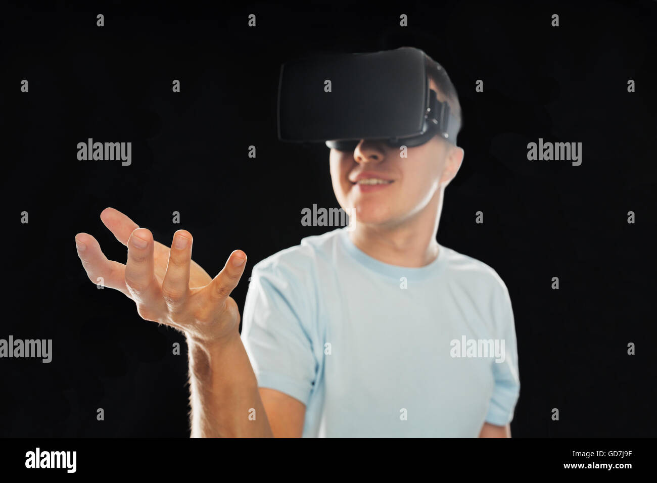 happy man in virtual reality headset or 3d glasses Stock Photo - Alamy