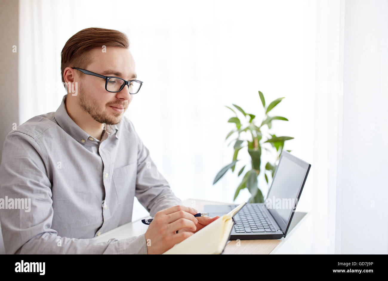 creative man or businessman writing to notebook Stock Photo - Alamy