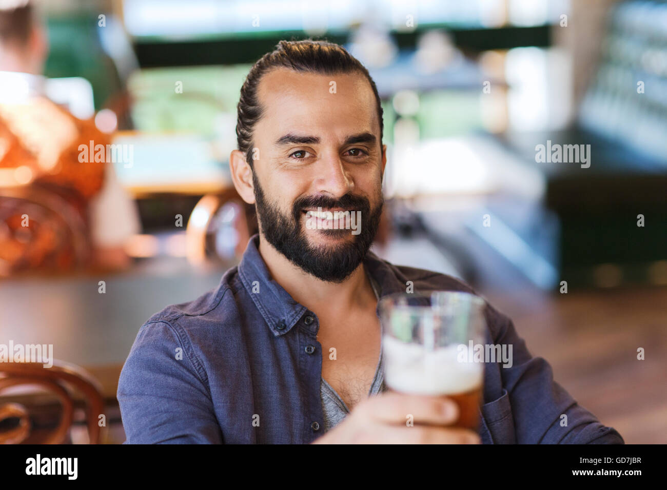 happy man drinking beer at bar or pub Stock Photo - Alamy