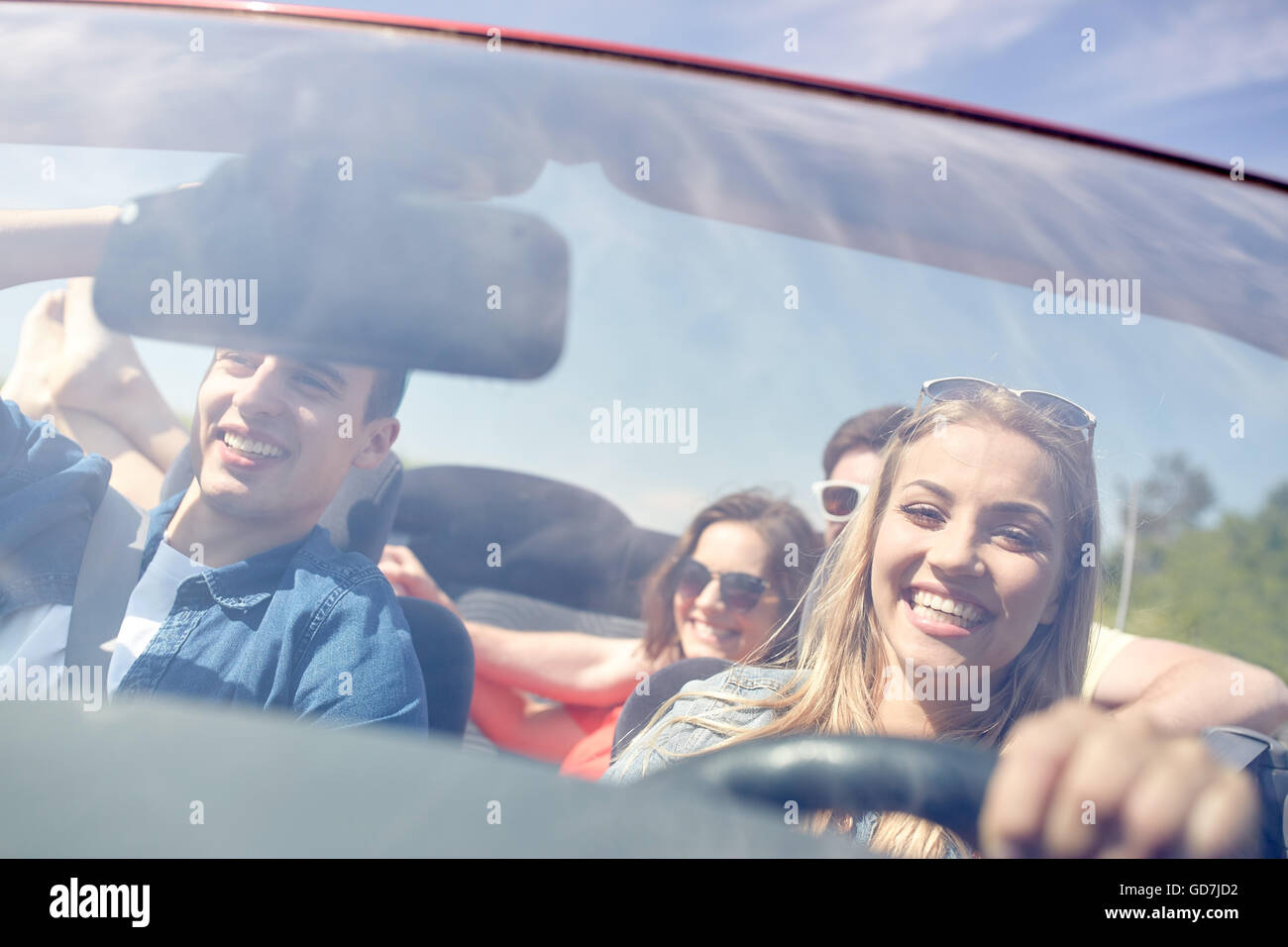 happy friends driving in cabriolet car Stock Photo - Alamy