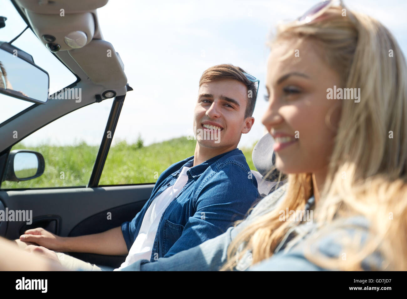 happy couple driving in cabriolet car outdoors Stock Photo - Alamy