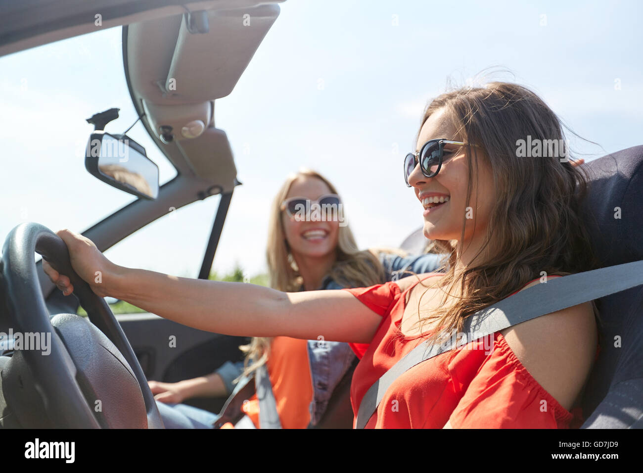 happy young women driving in cabriolet car Stock Photo - Alamy