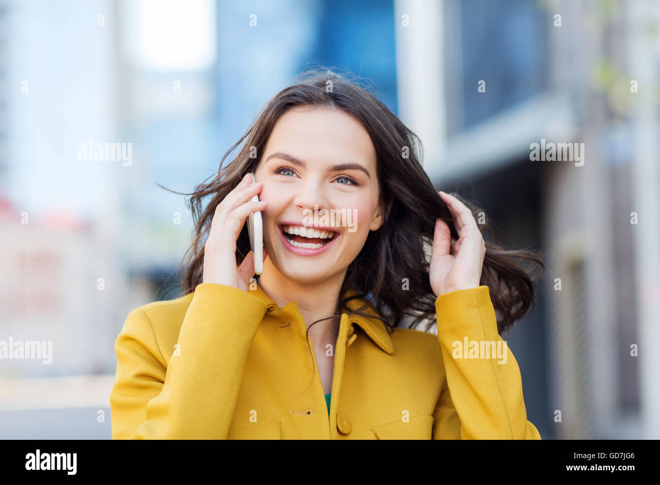 smiling young woman or girl calling on smartphone Stock Photo - Alamy