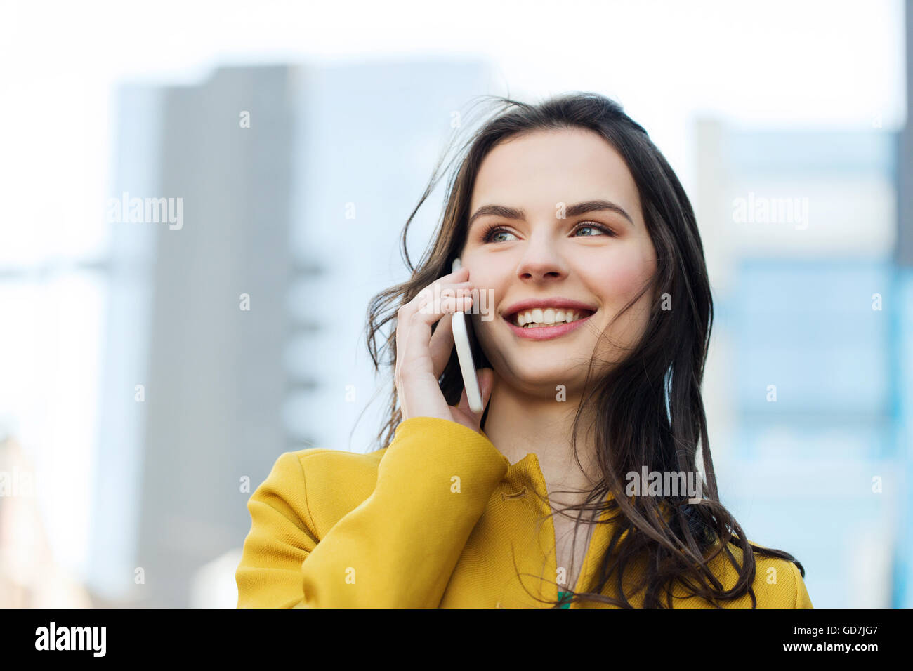 smiling young woman or girl calling on smartphone Stock Photo - Alamy