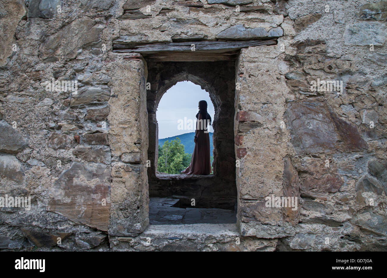 woman in a window of an old monastery Stock Photo - Alamy