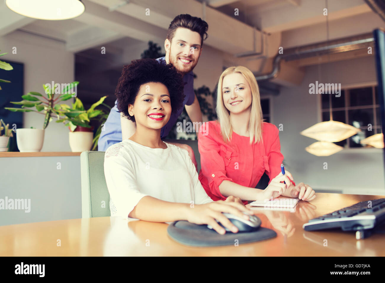 happy creative team in office Stock Photo - Alamy