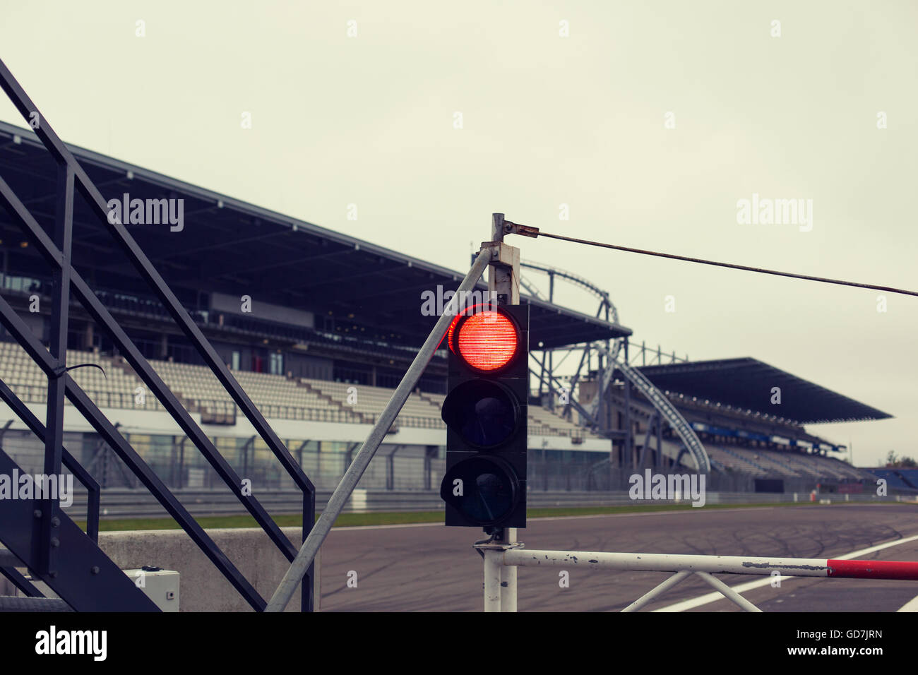 red traffic lights and road sign on race track Stock Photo - Alamy