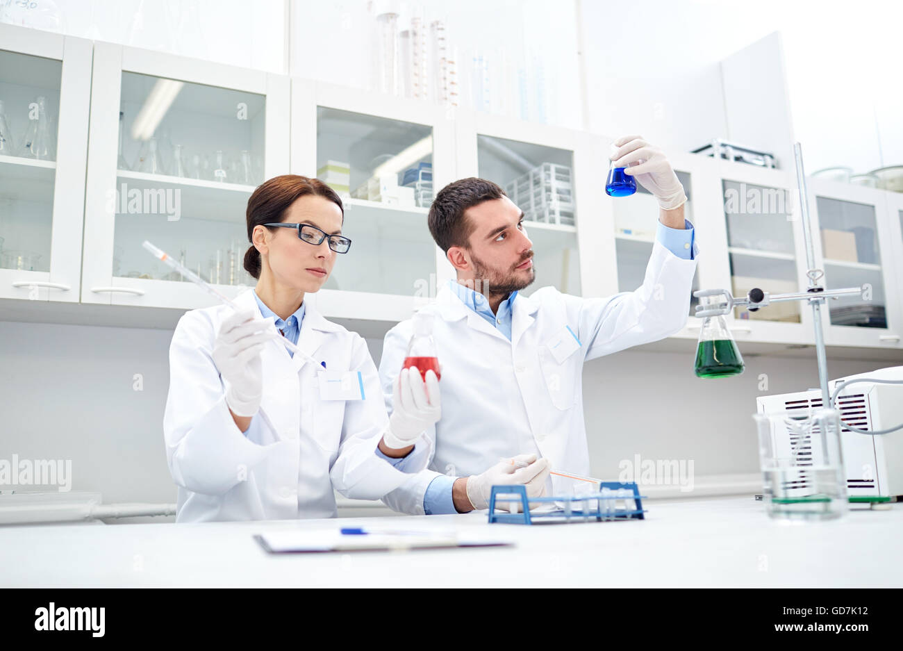 young scientists making test or research in lab Stock Photo - Alamy