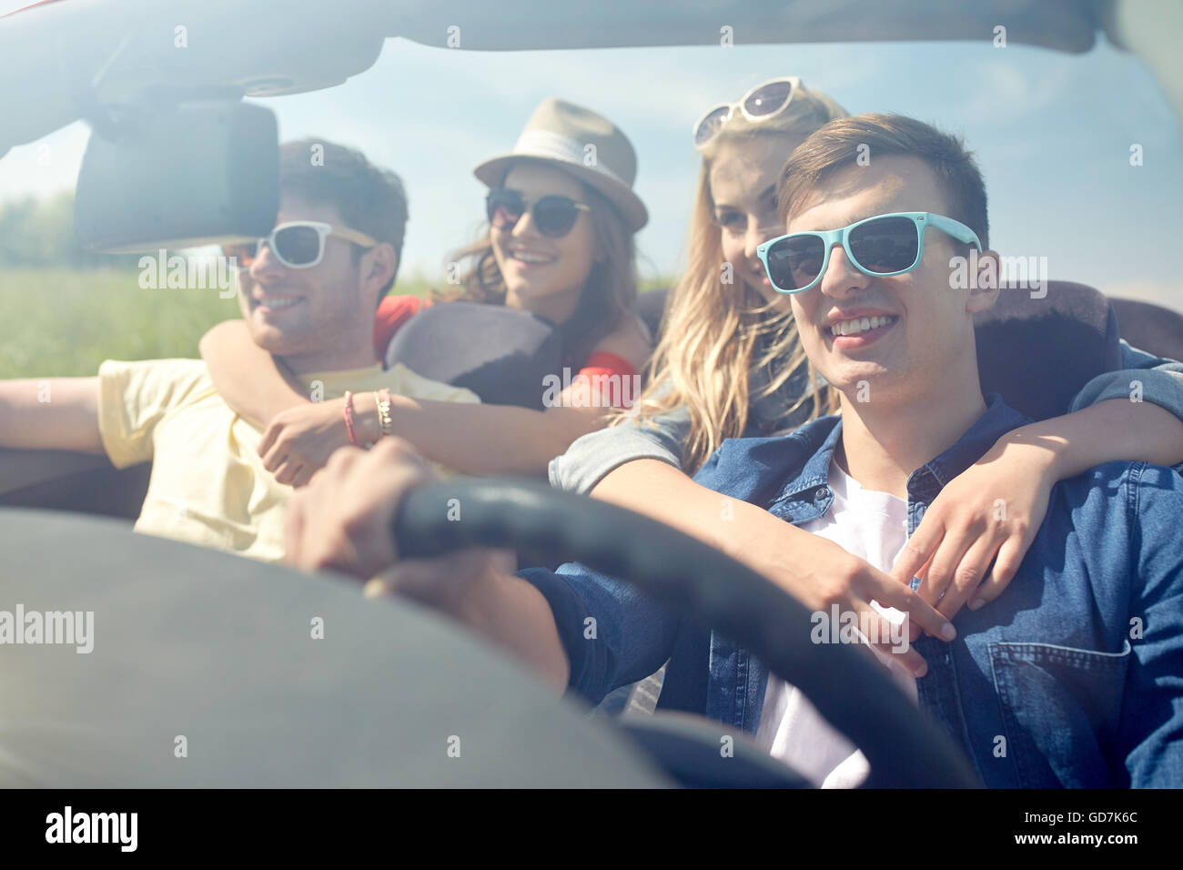 happy friends driving in cabriolet car outdoors Stock Photo - Alamy