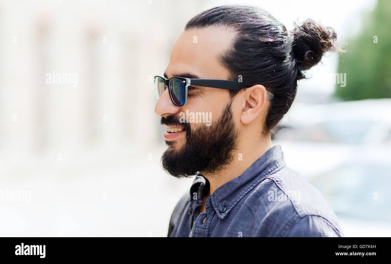 happy smiling man with beard on city street Stock Photo - Alamy