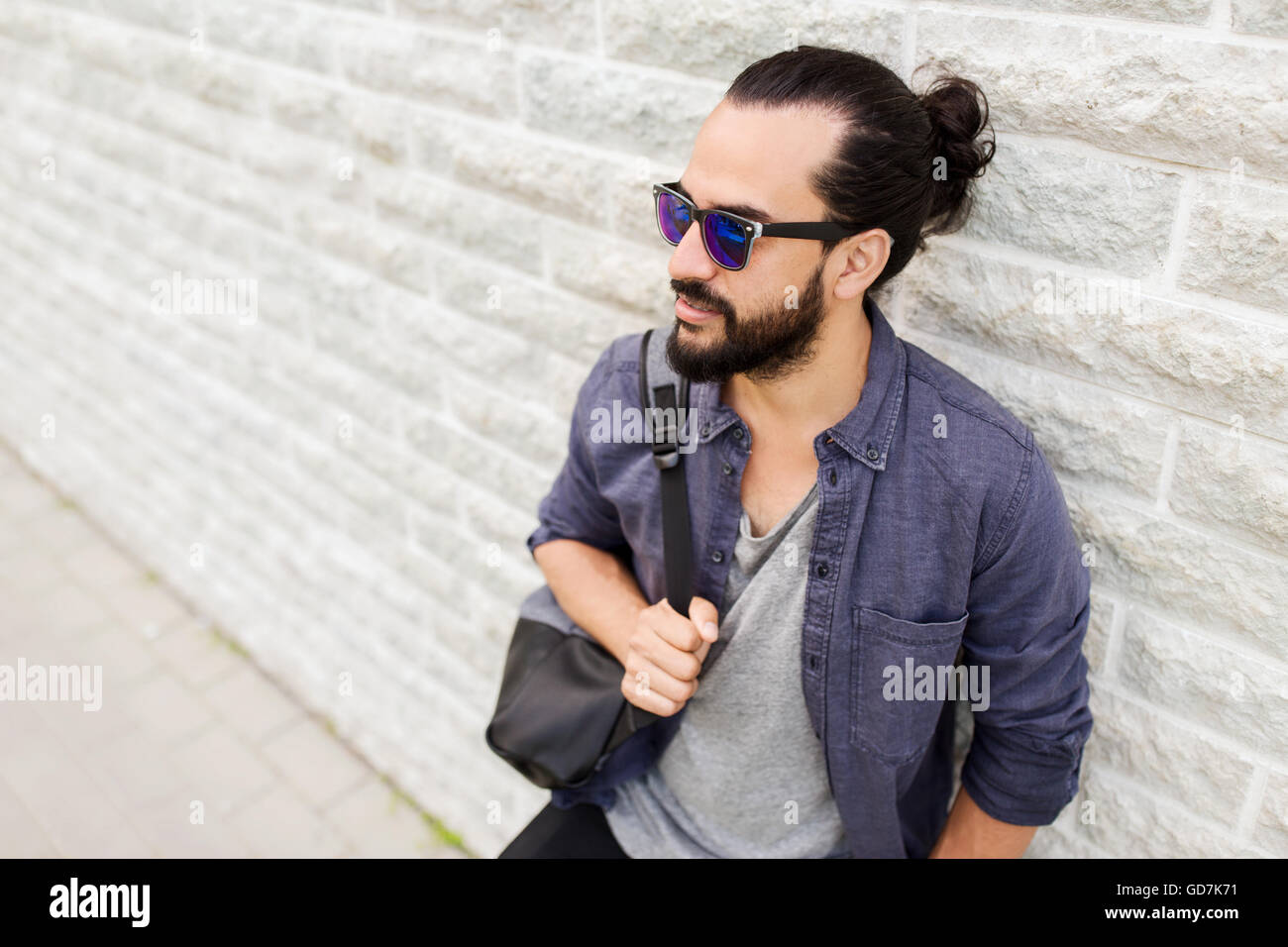 man with backpack standing at city street wall Stock Photo - Alamy