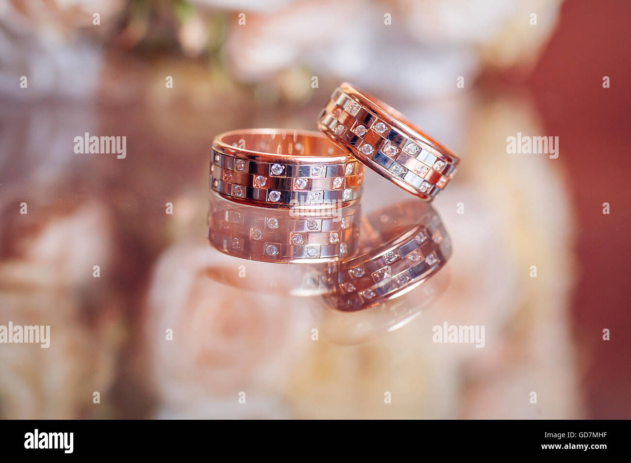 A pair of wedding rings with bokeh background Stock Photo - Alamy