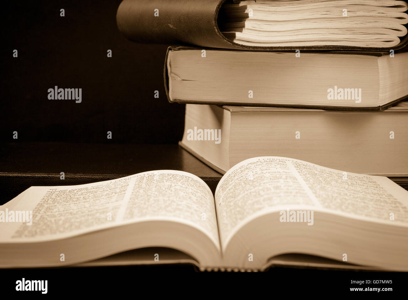 Stack of old books, one is opened, retro look, copy-space Stock Photo ...