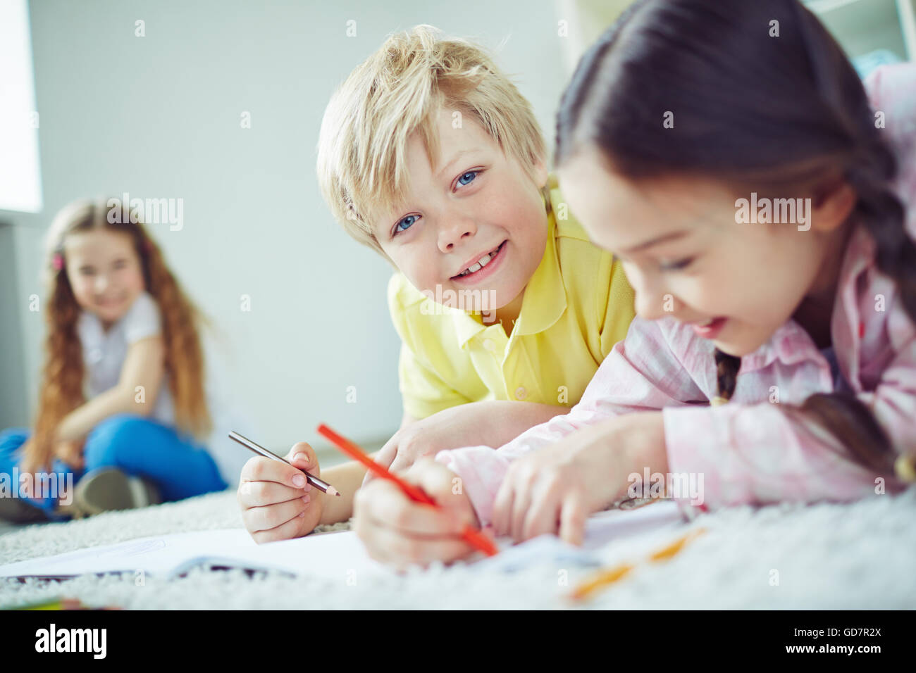 Cute boy drawing Stock Photo - Alamy