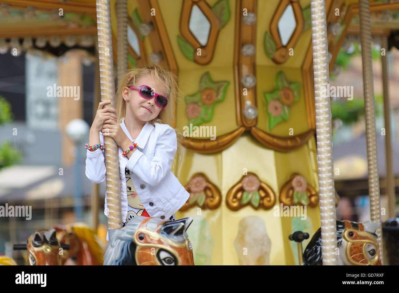 Child On Carousel Stock Photo - Alamy