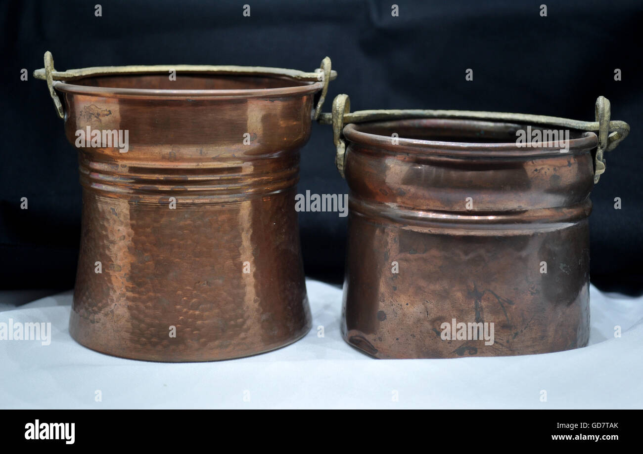 two cauldrons an black background Stock Photo - Alamy