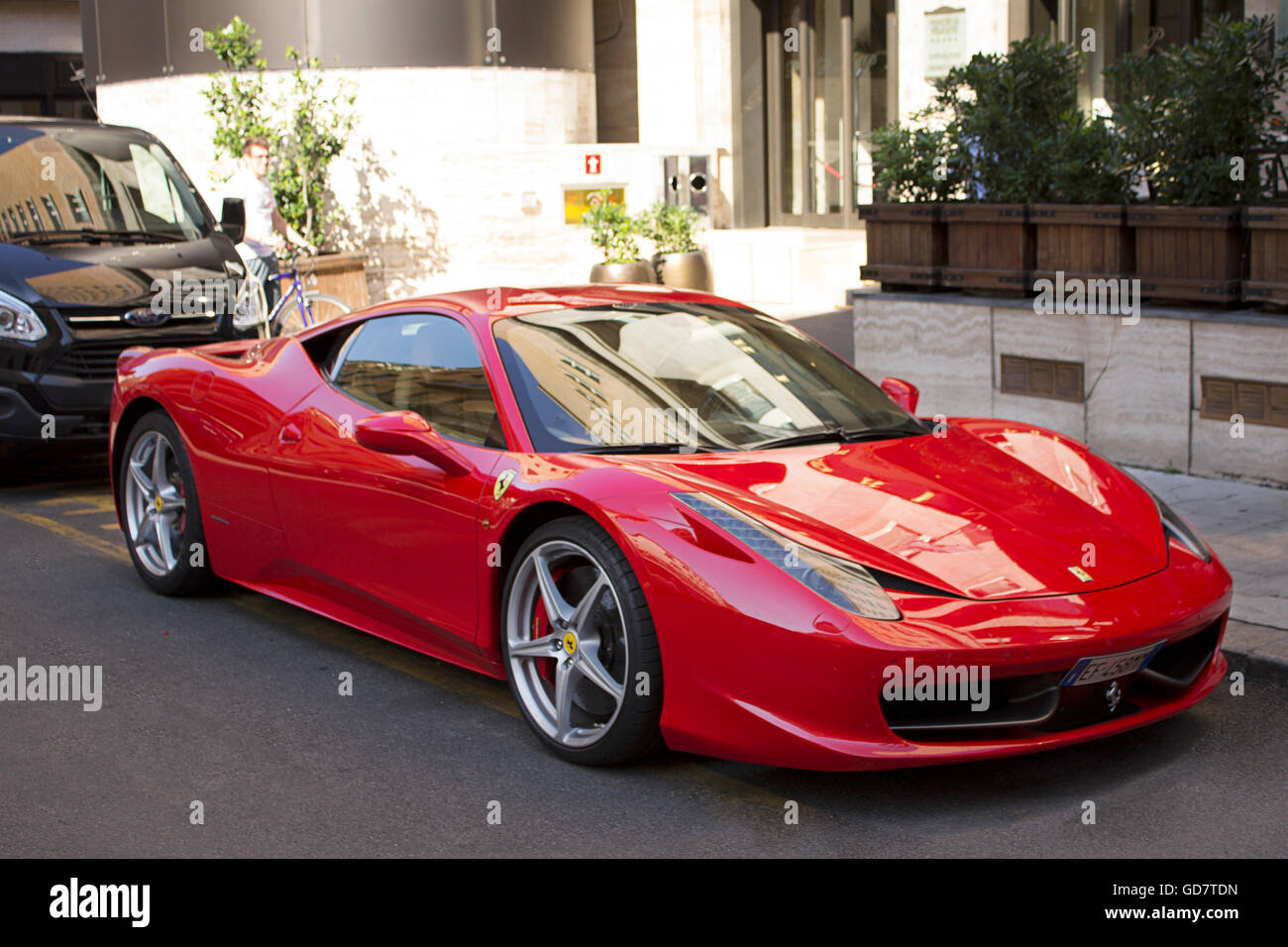 Luxury red Ferrari Italian supercar in front of Principe di Piemonte ...