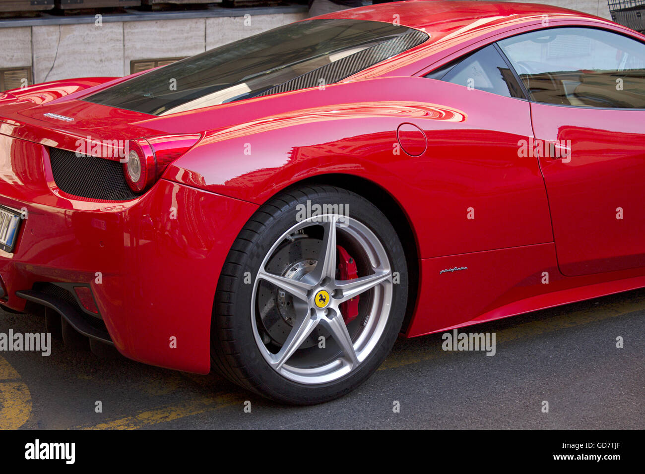 Luxury red Ferrari Italian supercar in front of Principe di Piemonte ...