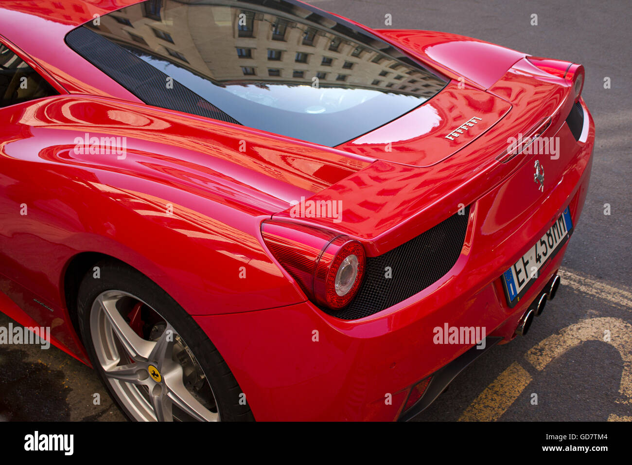 Luxury red Ferrari Italian supercar in front of Principe di Piemonte ...