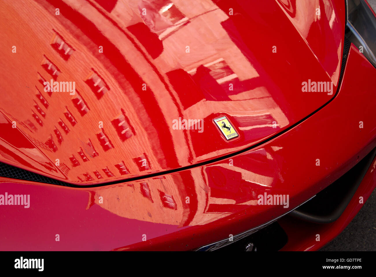 Luxury red Ferrari Italian supercar in front of Principe di Piemonte ...