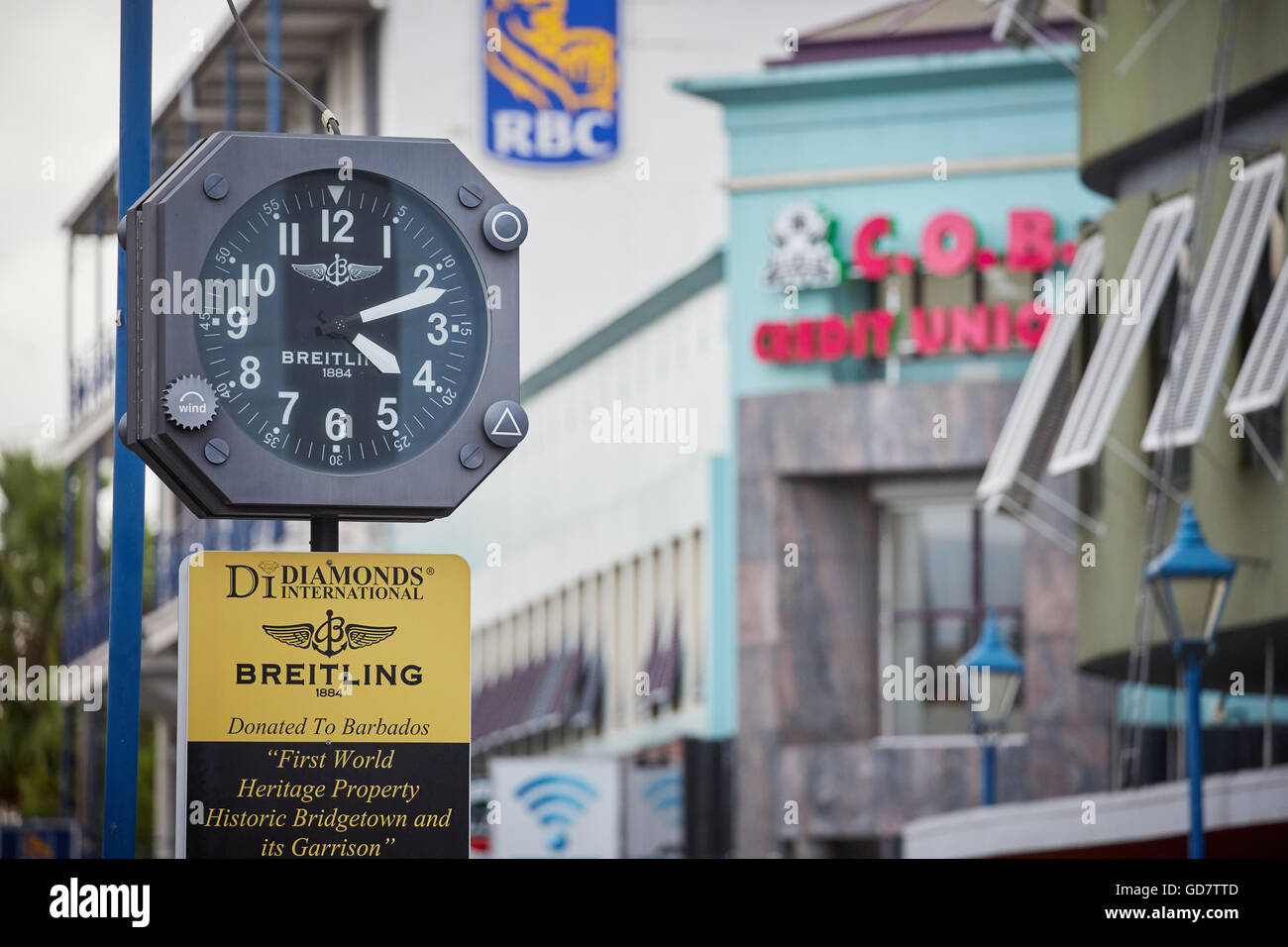 Clock hanging on building hi-res stock photography and images - Alamy