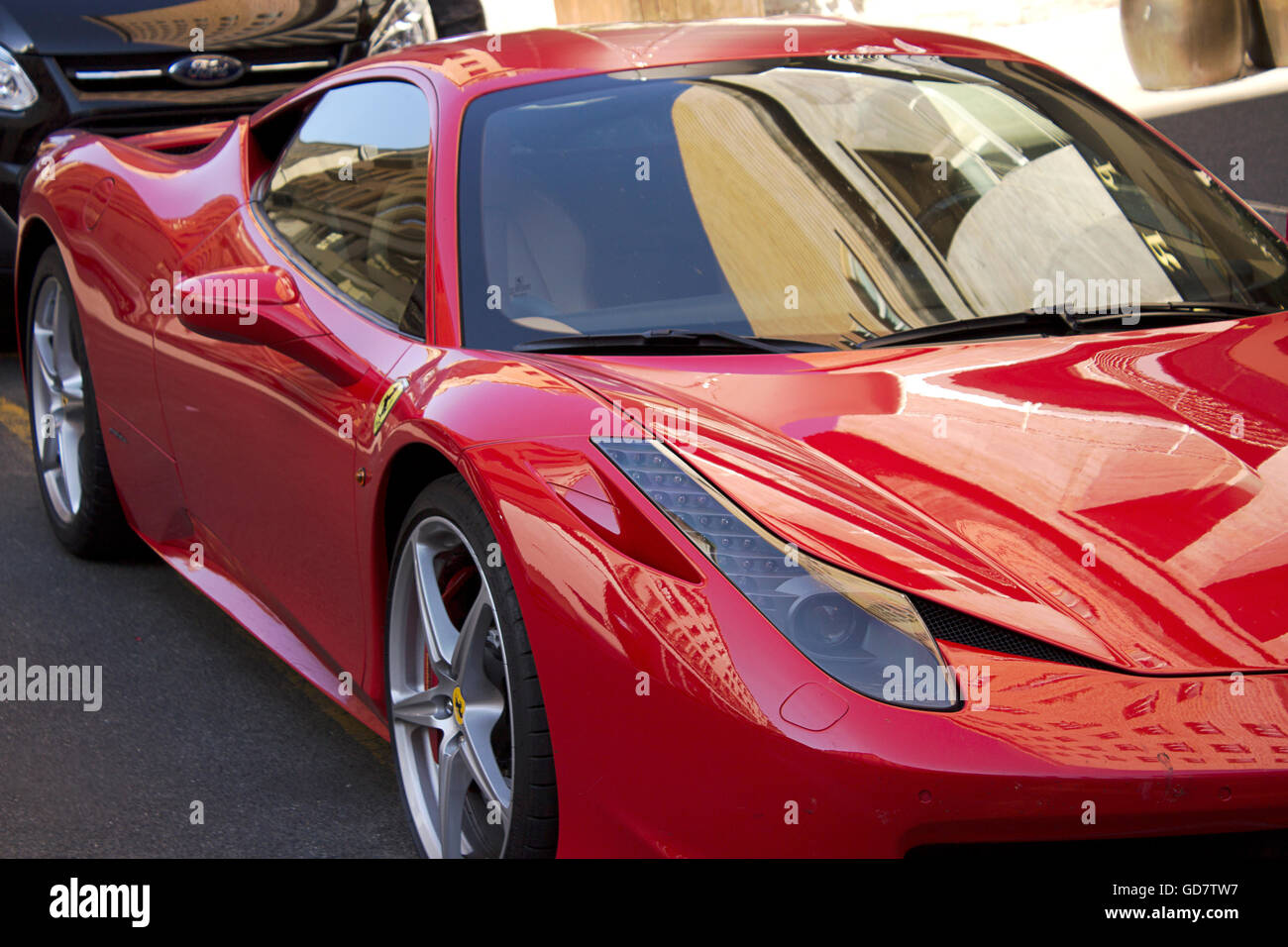Luxury red Ferrari Italian supercar in front of Principe di Piemonte ...