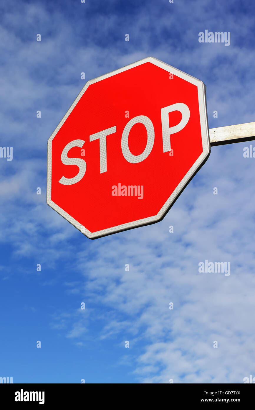 Stop sign on blue sky. Safety on road Stock Photo - Alamy