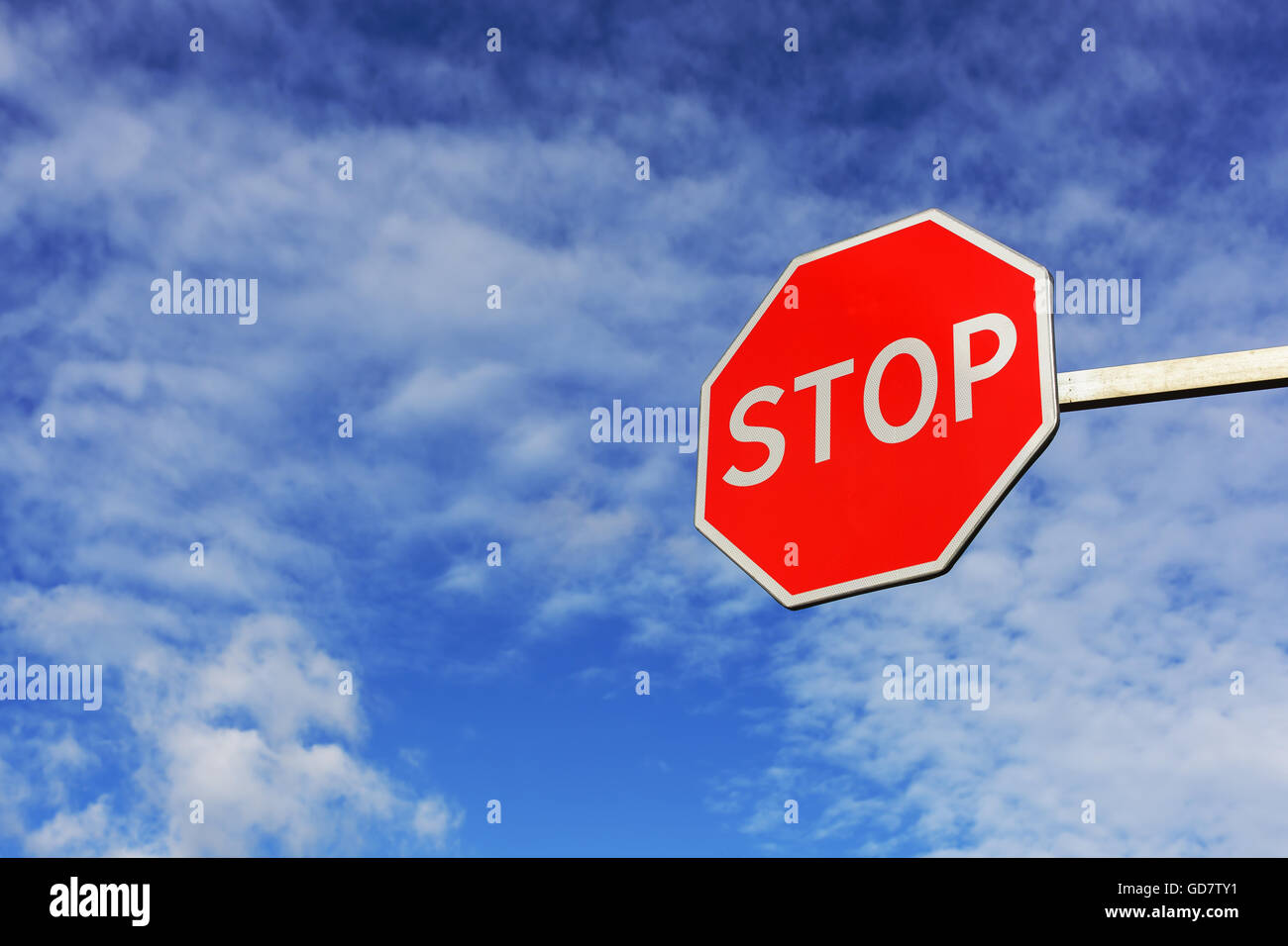 Stop sign on blue sky. Safety on road Stock Photo - Alamy