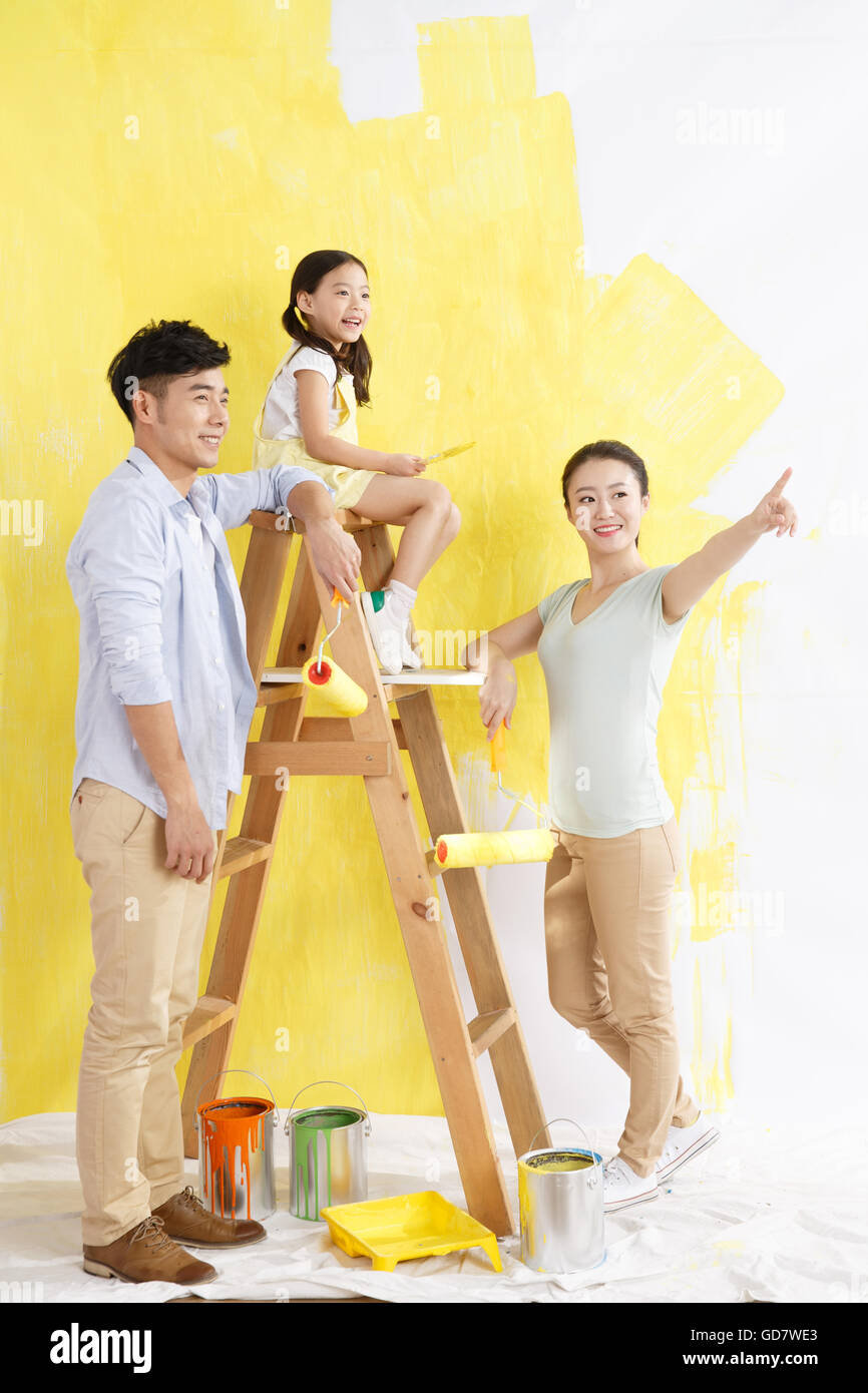 Happy families in the paint for the walls Stock Photo - Alamy