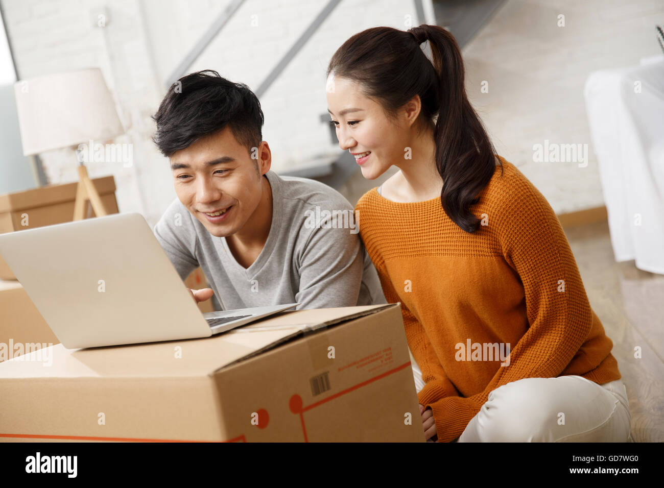 Young couples use notebook computers Stock Photo - Alamy