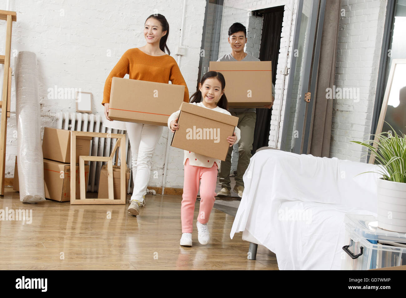 Happy family moved to new home Stock Photo - Alamy
