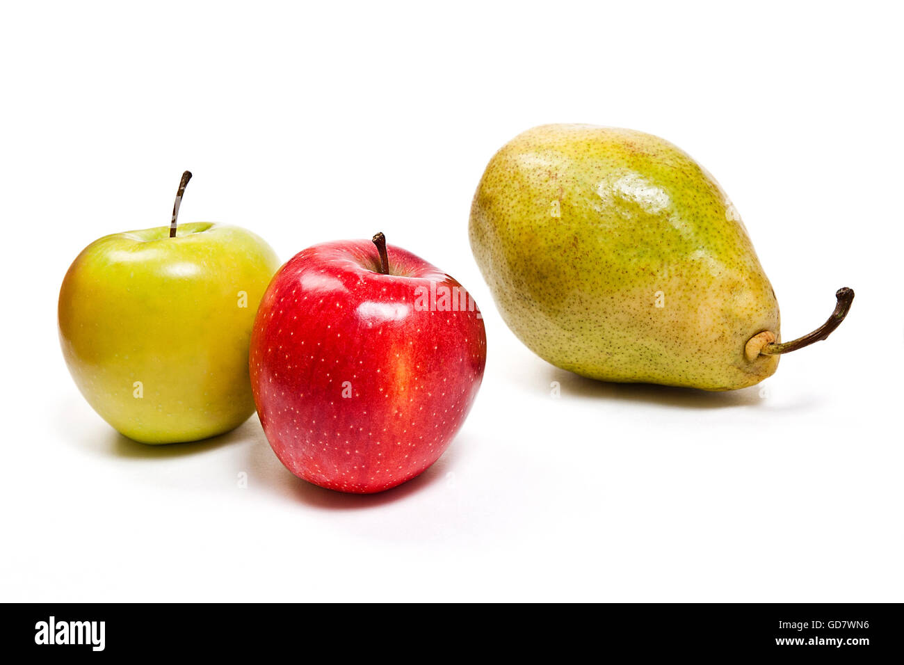 One fresh green pear and two apples in red and green color. With ...