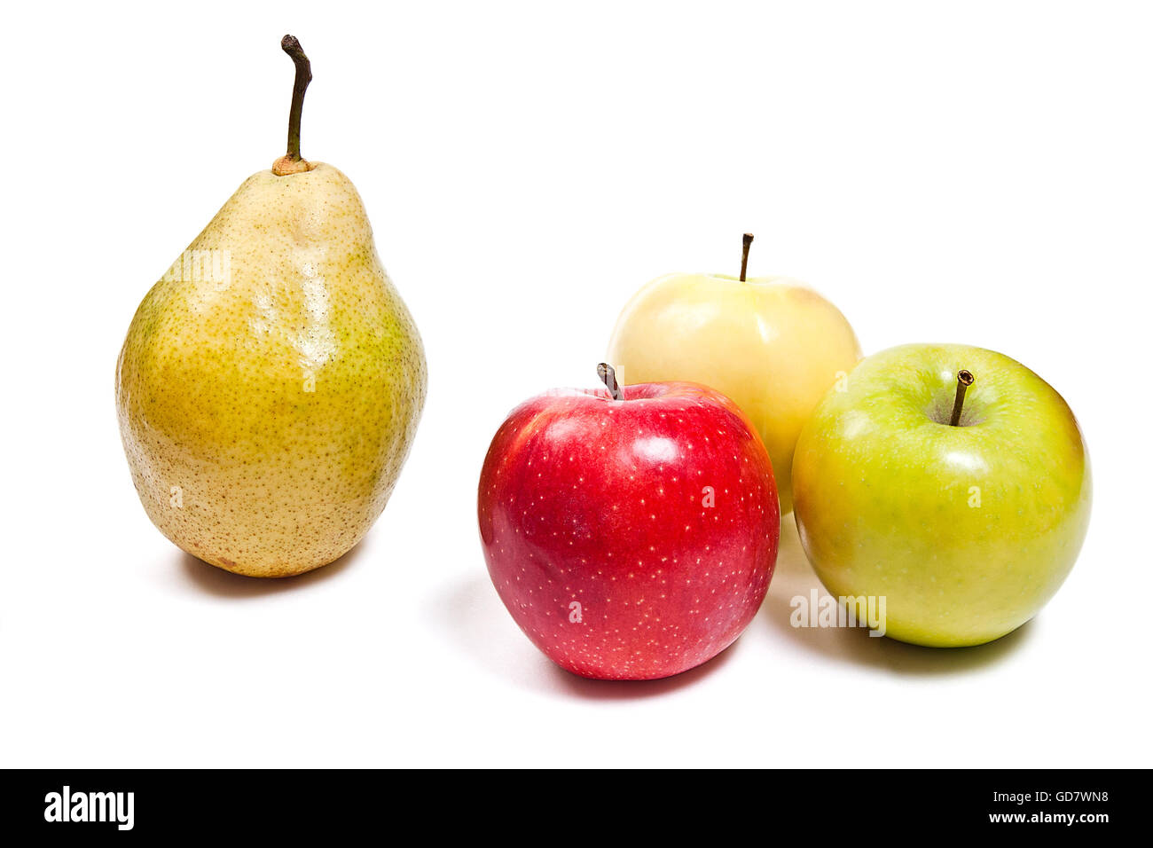 One fresh green pear and three apples in red, green and yellow color ...